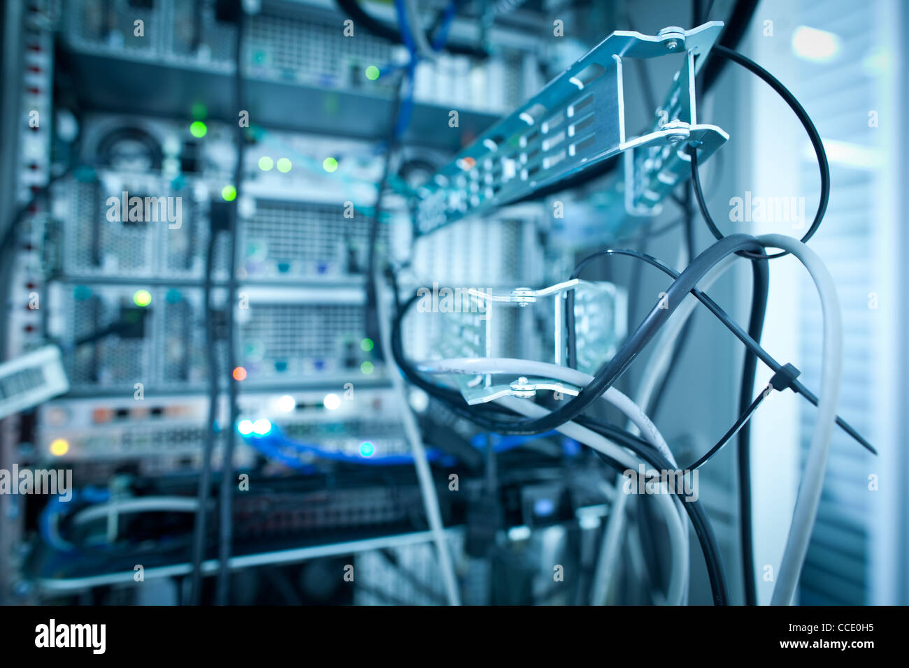 Server rack cluster in a data center (shallow DOF; color toned image ...