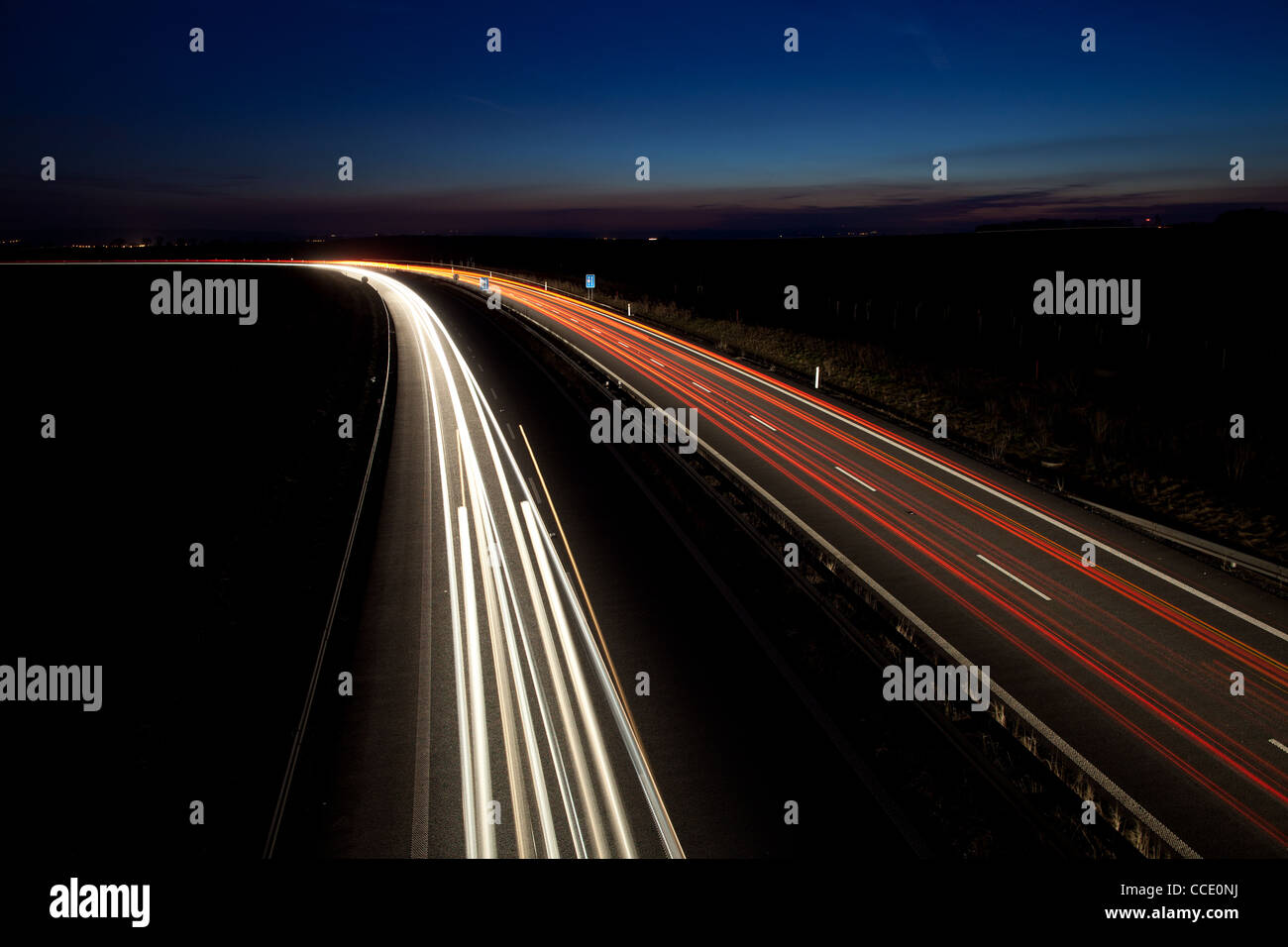 Cars moving fast on a highway Stock Photo - Alamy
