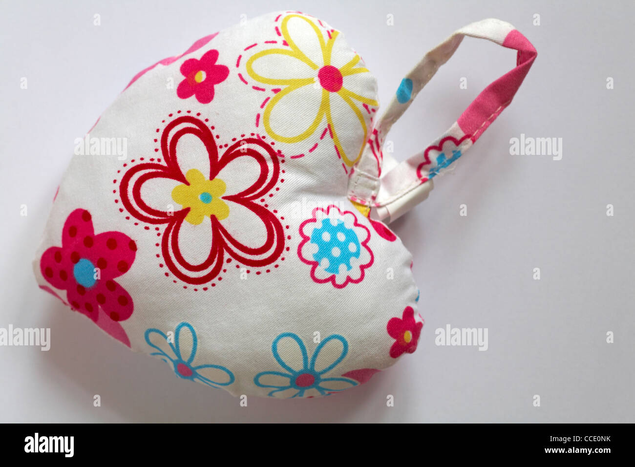 Heart shaped material decoration with flowers on isolated on white ...