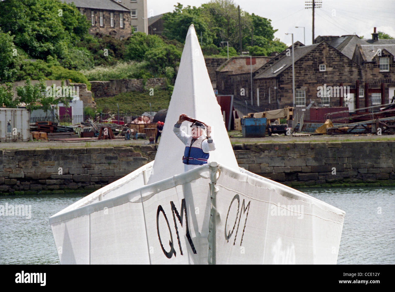 Sculptor George Wyllie's (on bow) Paper boat in the water at the ...