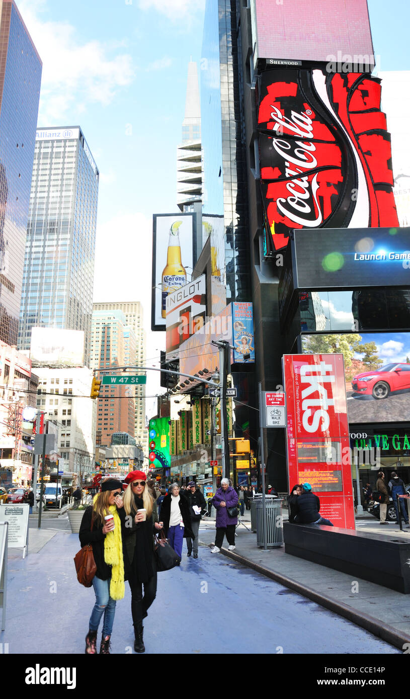 Times Square and young girls walking, New York City, USA Stock Photo ...