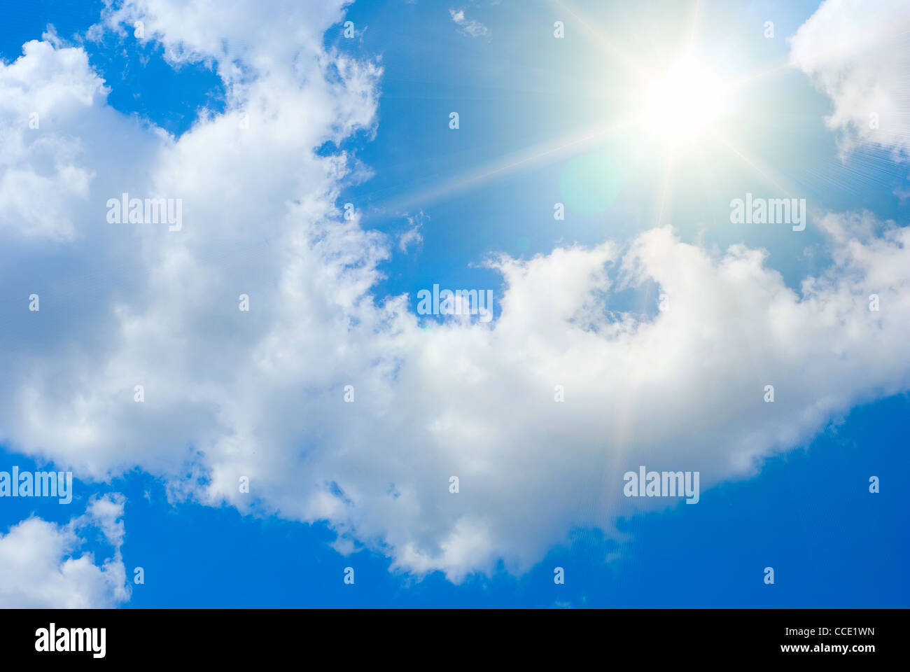 Sun rays against a blue summer sky Stock Photo - Alamy