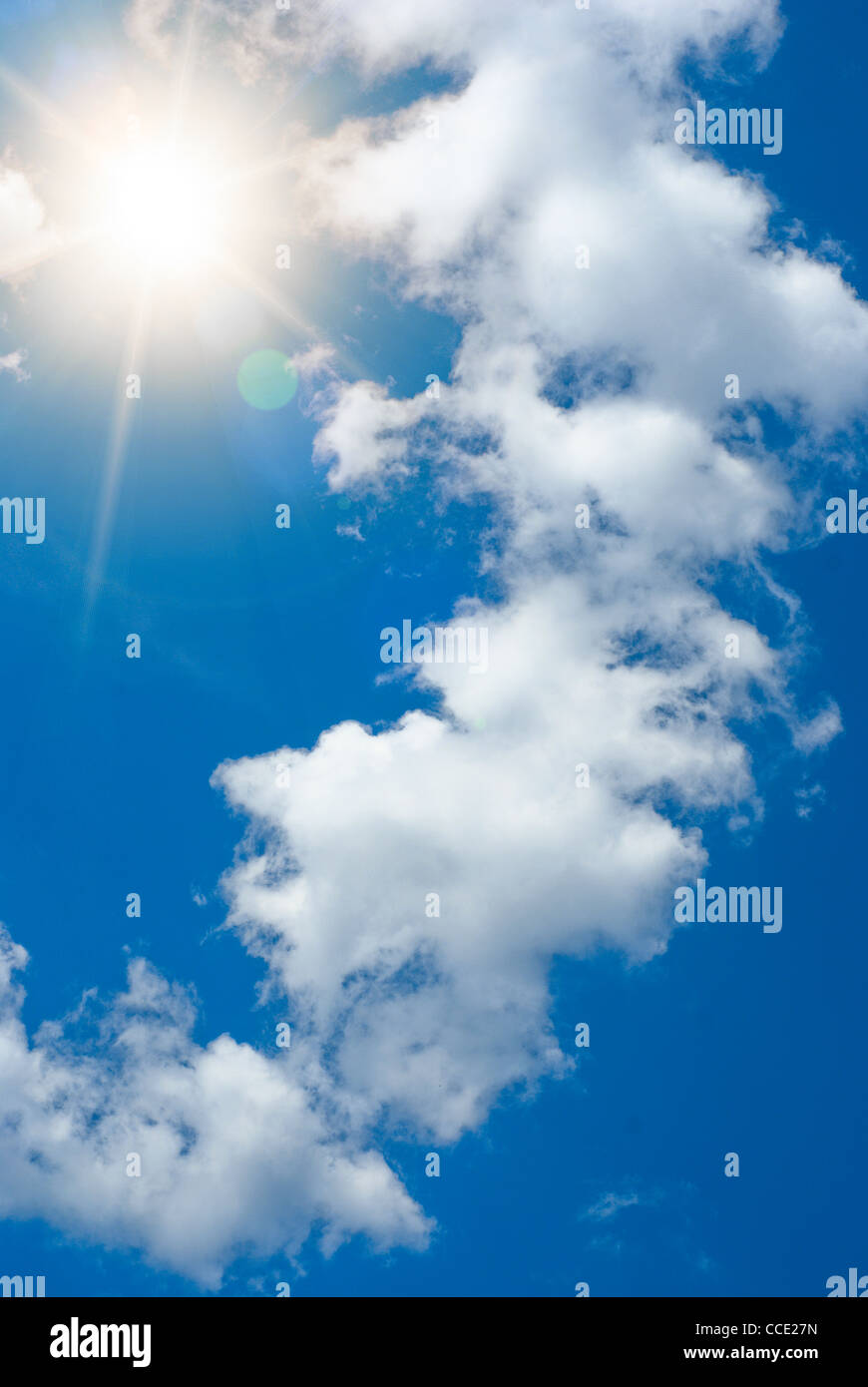 Sun rays against a blue summer sky. Vertical orientation Stock Photo ...