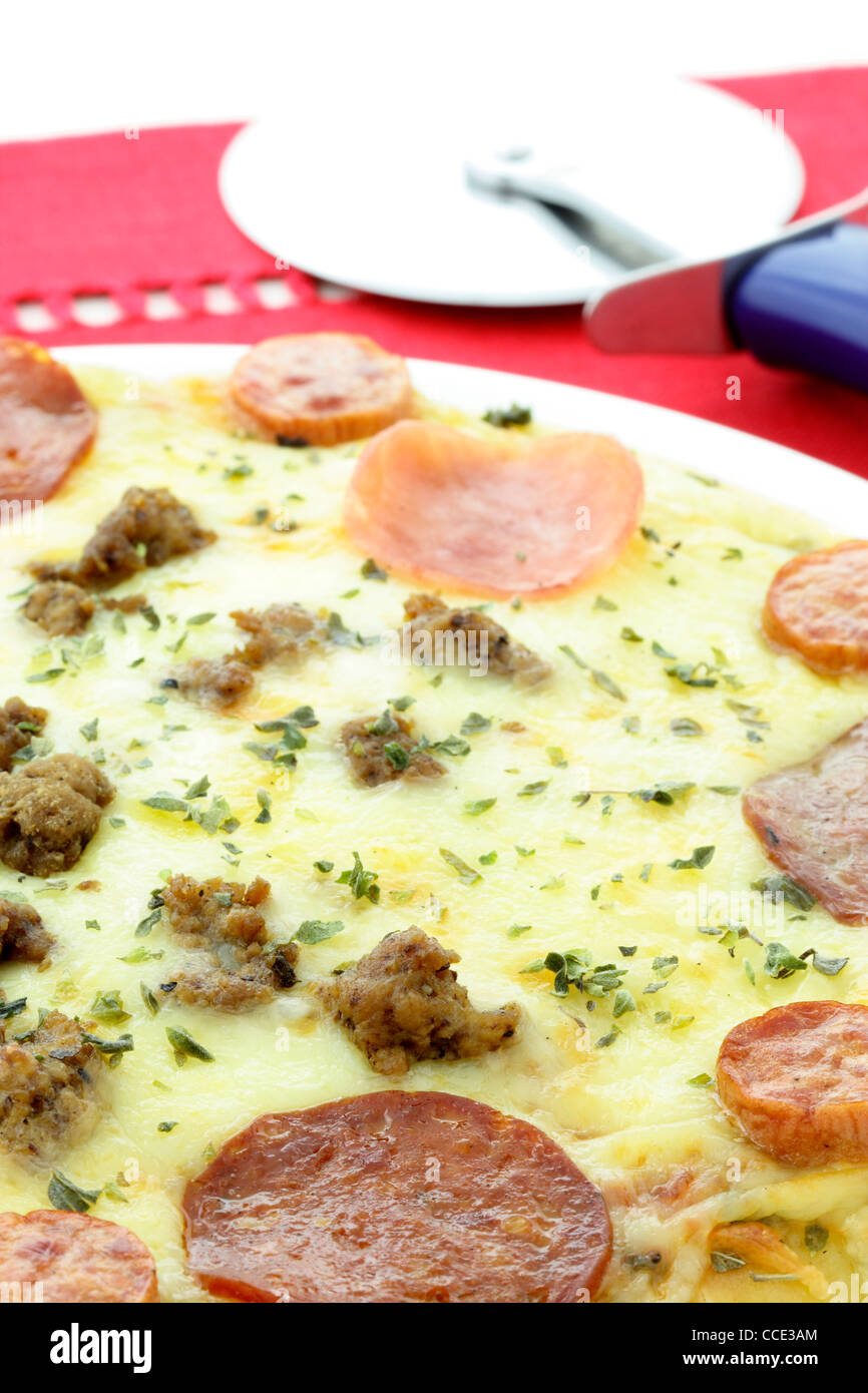 hot ready to eat delicious rustic meat lovers pizza Stock Photo - Alamy