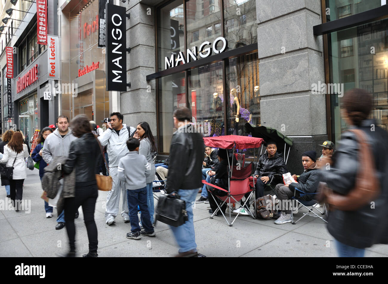 Sidewalk camping at Mango store, New York, USA Stock Photo - Alamy