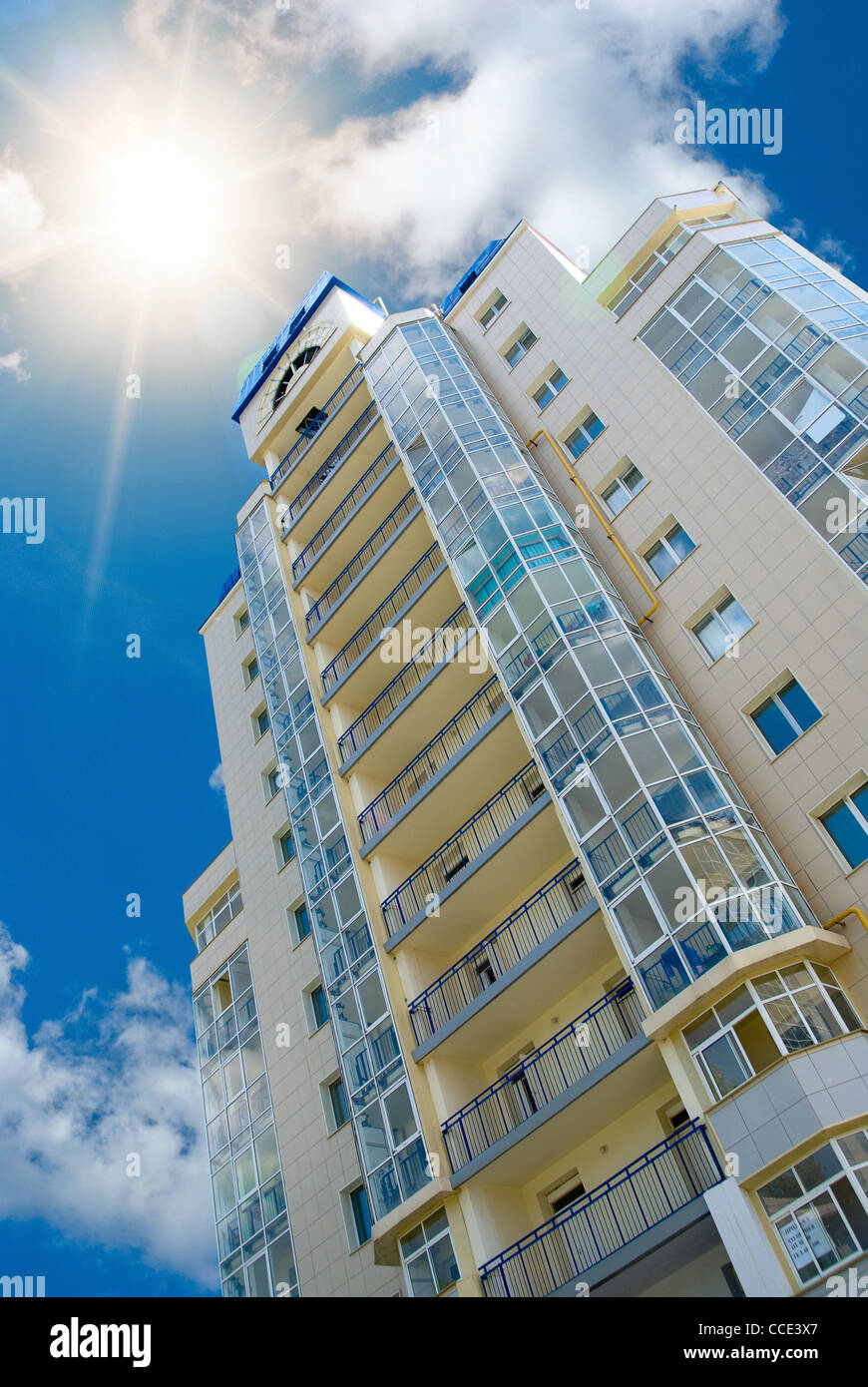 Skyscraper on blue sky background Stock Photo - Alamy
