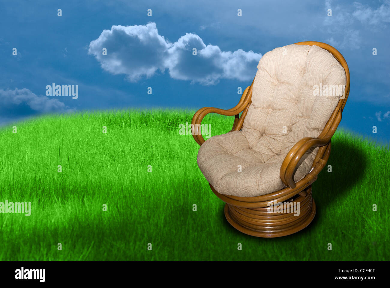 wicker chair on green grass background Stock Photo - Alamy
