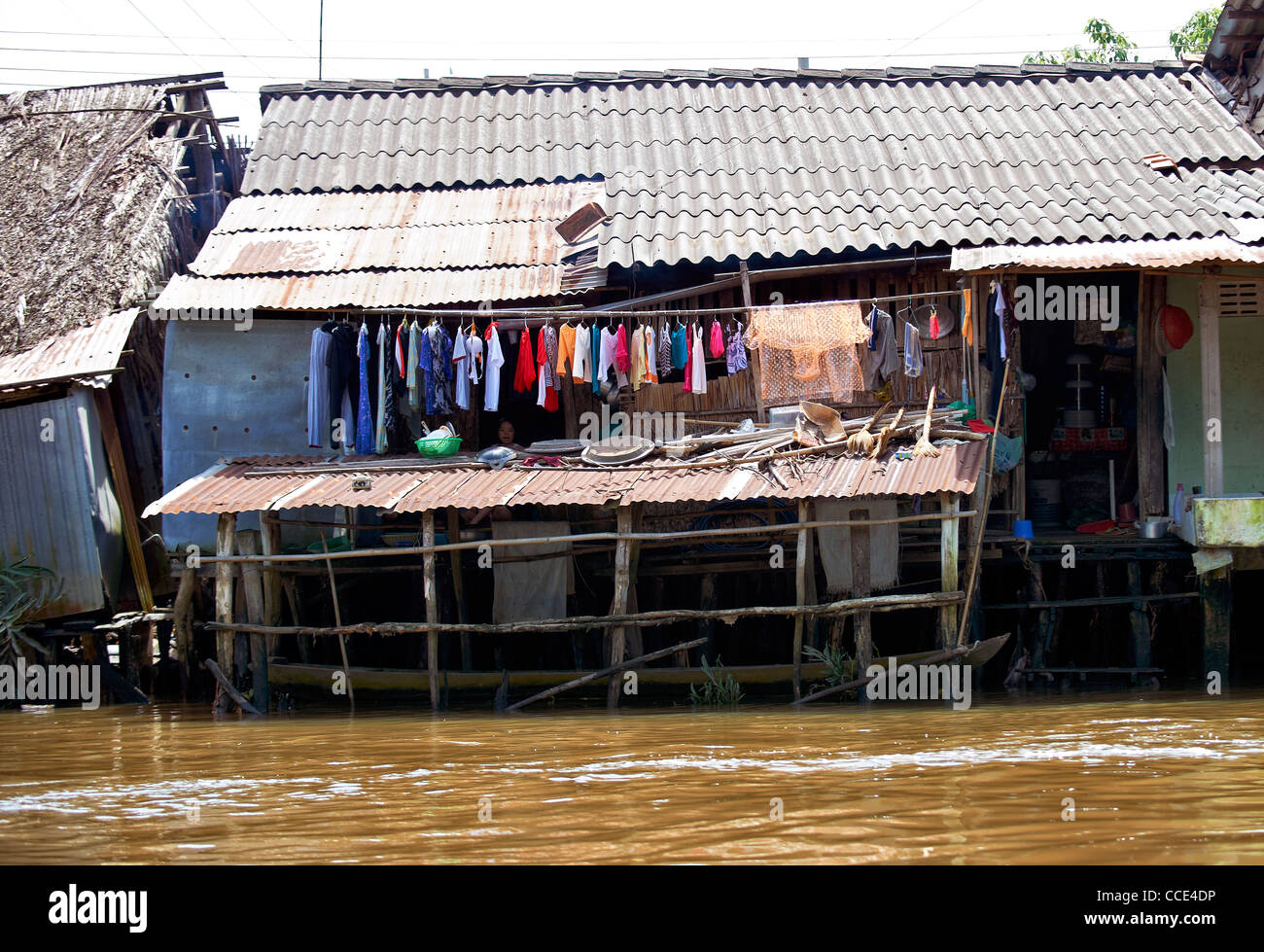Mekong river scene showing a dilapidated house on stilts Stock Photo ...