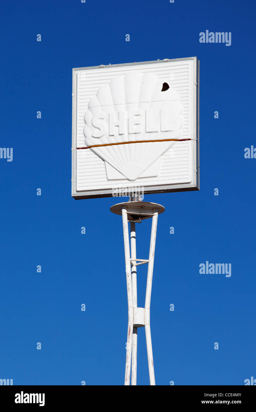 An old cracked and worn Shell service station sign painted white Stock ...
