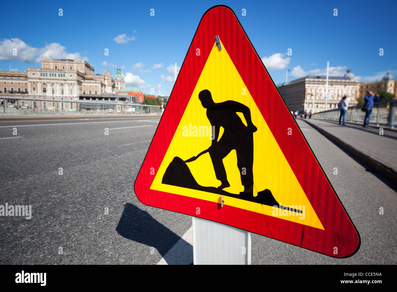Caution digging sign on city background Stock Photo - Alamy