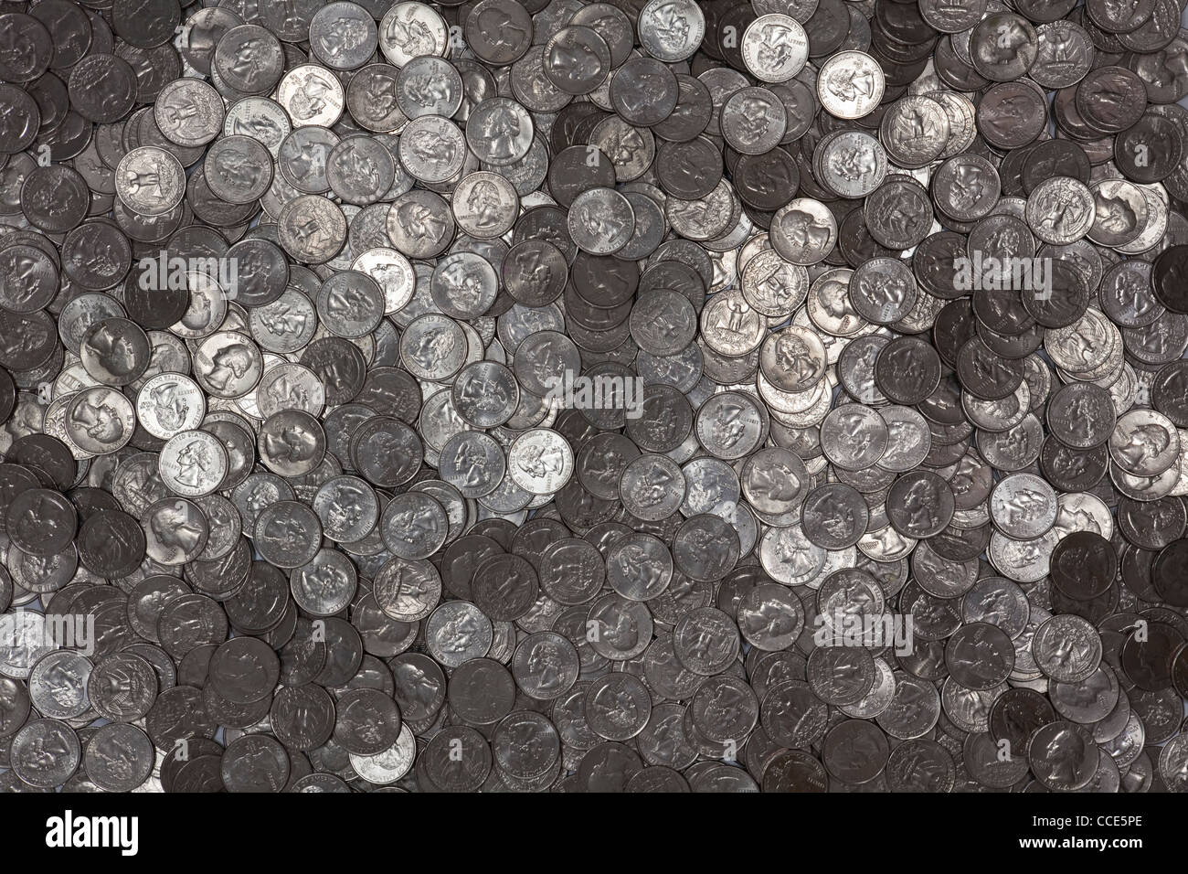 Reflective US Quarters background. Newer "States" quarters are face up ...