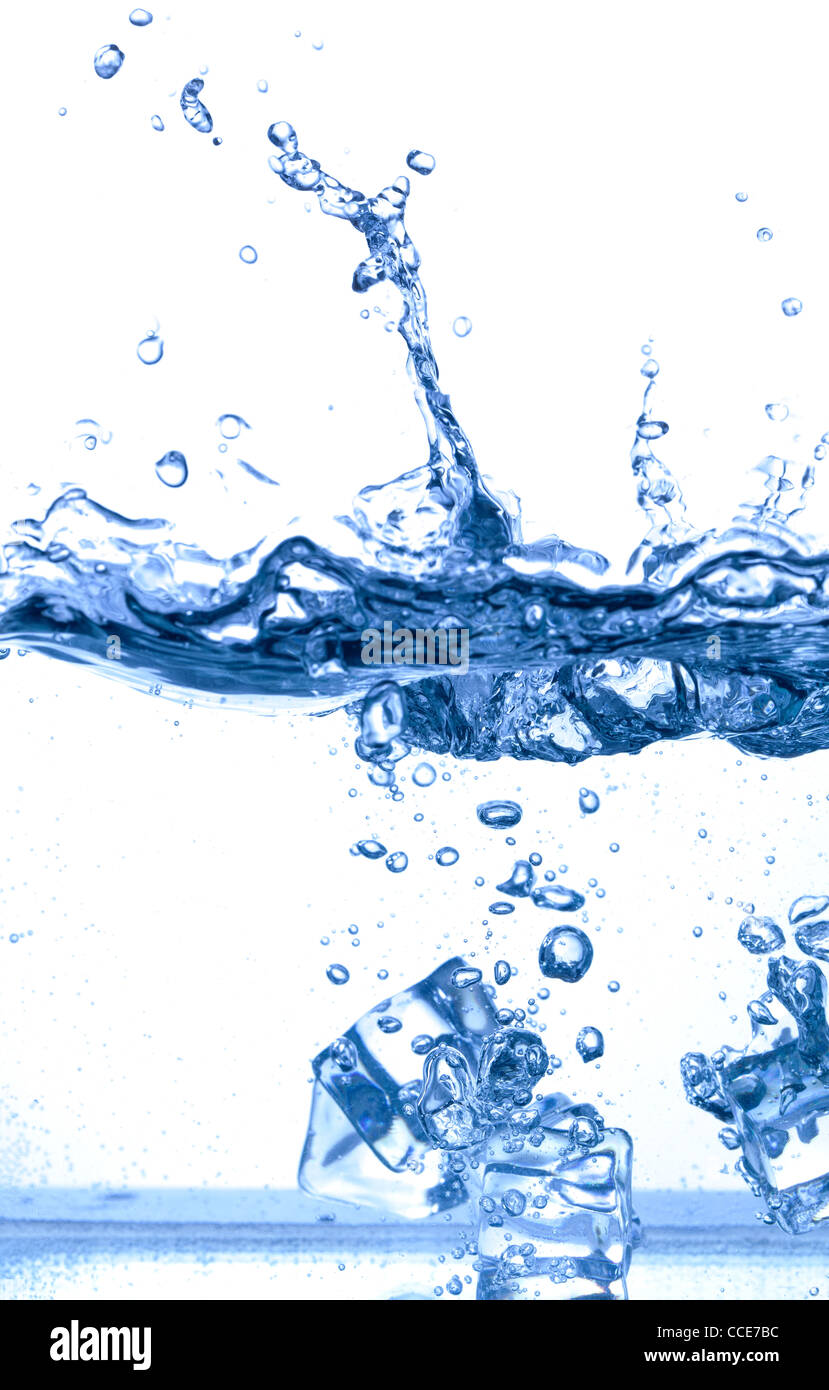 ice cubes dropped into water with splash on white Stock Photo - Alamy