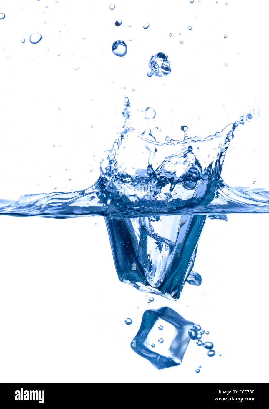 ice cubes dropped into water with splash on white Stock Photo - Alamy