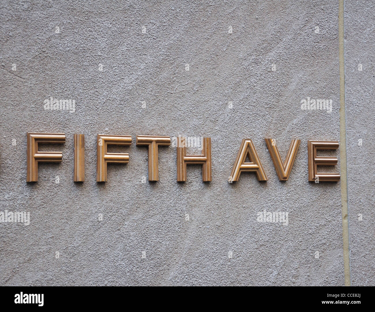 Fifth ave sign on building wall, New York, USA Stock Photo - Alamy