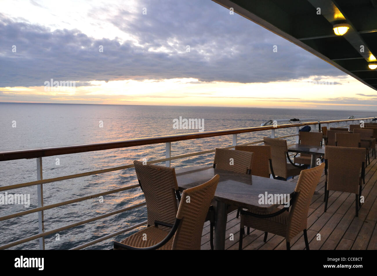 Cruise ship deck at sunset Stock Photo - Alamy