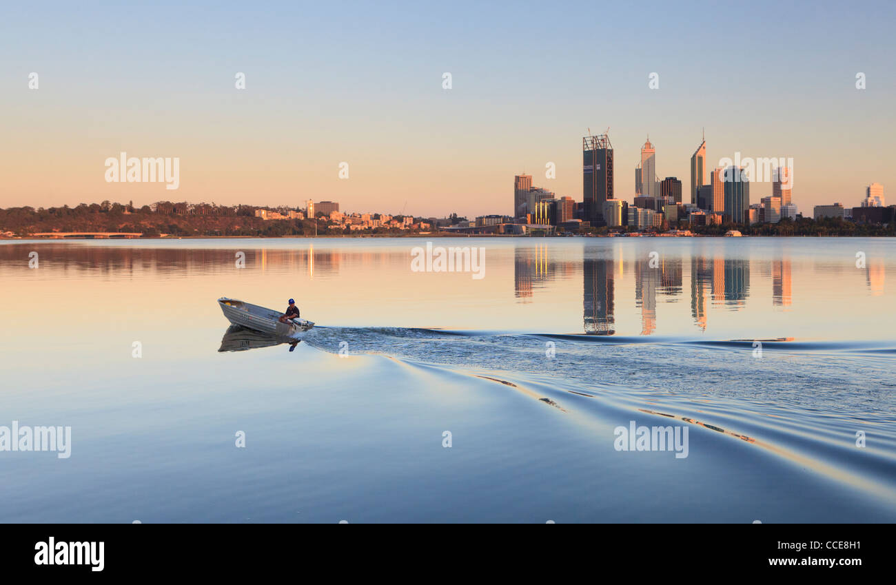 Boat on the the Swan River with Perth city in the distance Stock Photo ...