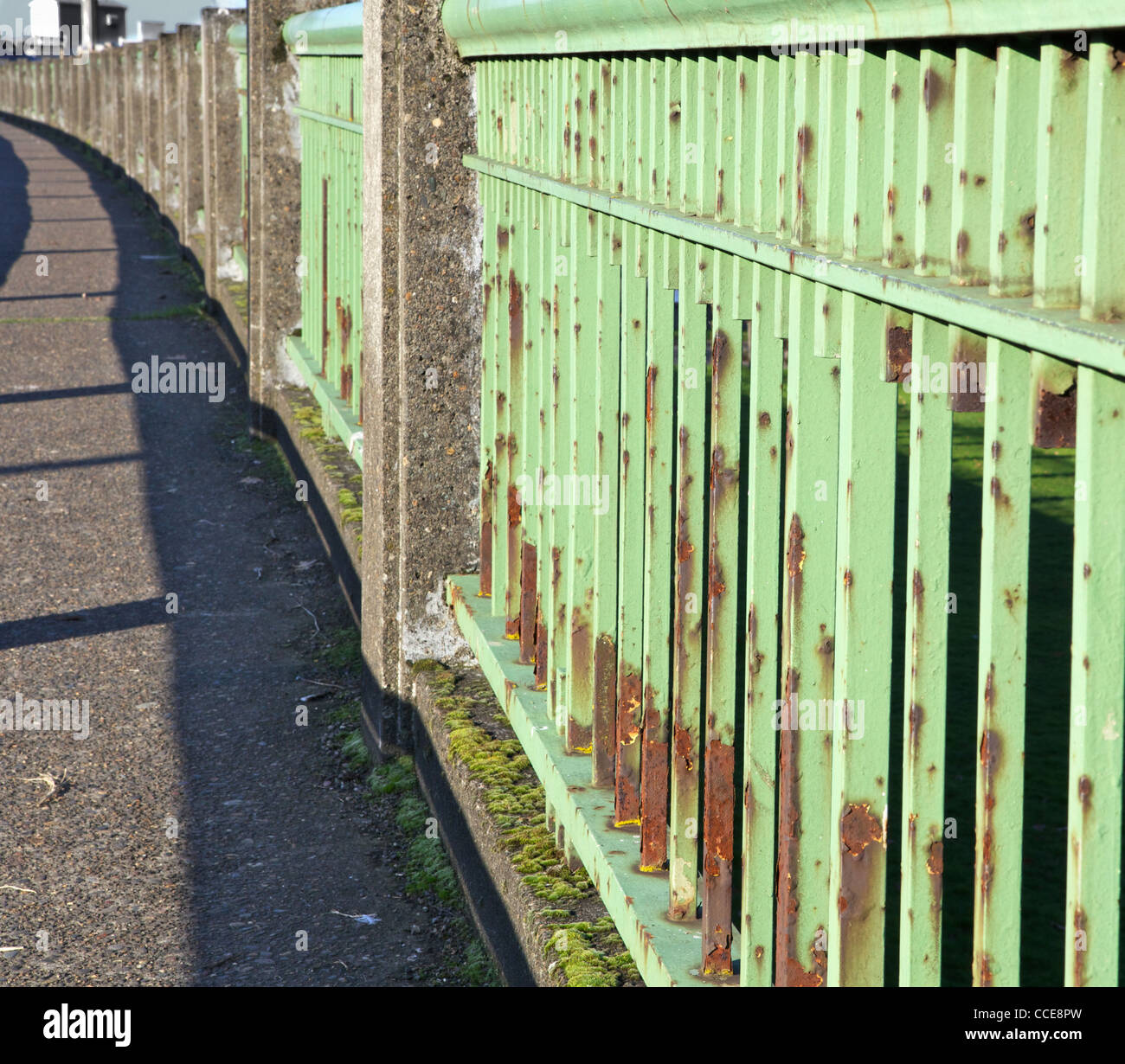 Green steel bridge railing that is rusted and worn Stock Photo - Alamy