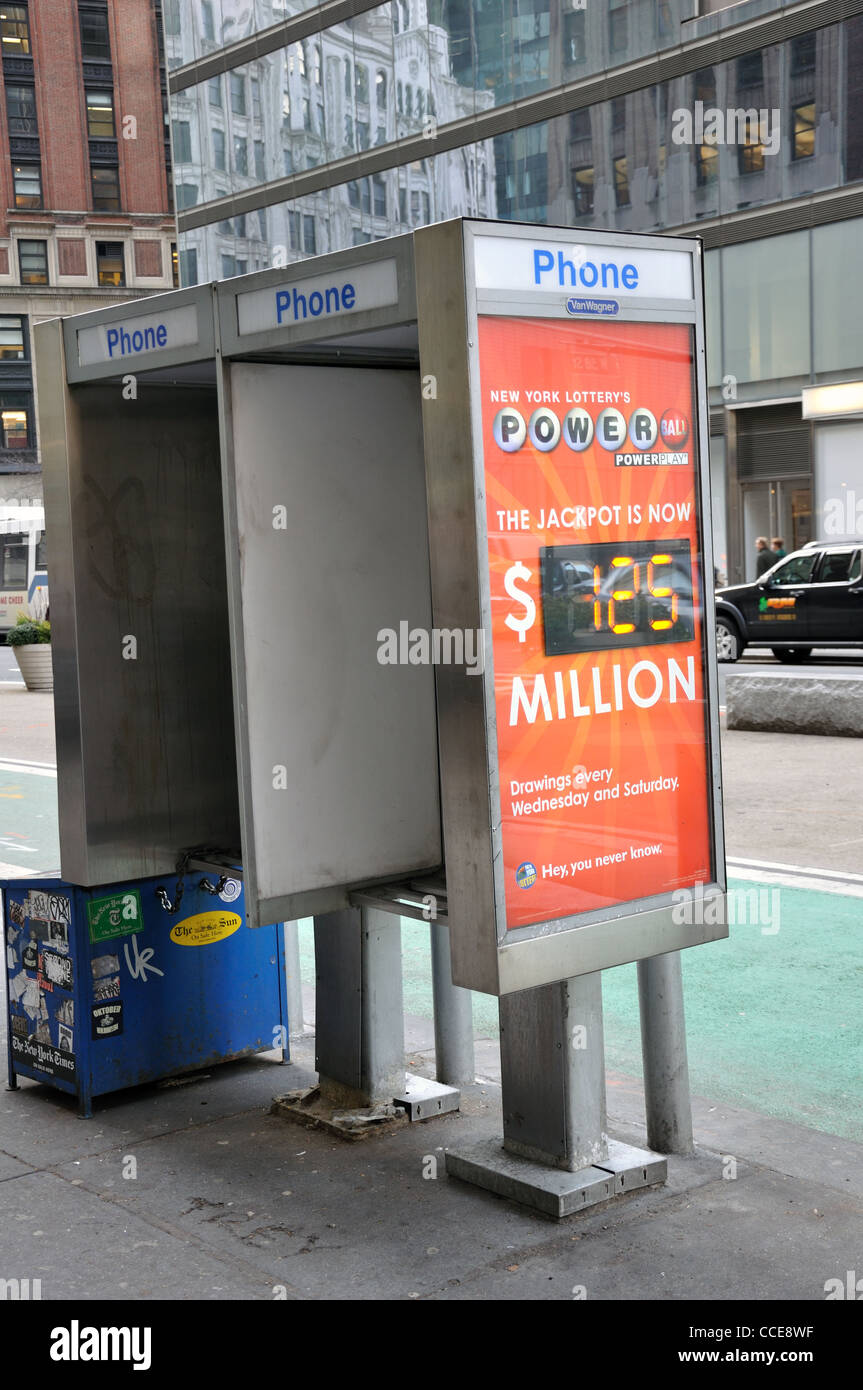 Pay phone booth with lottery ad, New York, USA Stock Photo - Alamy