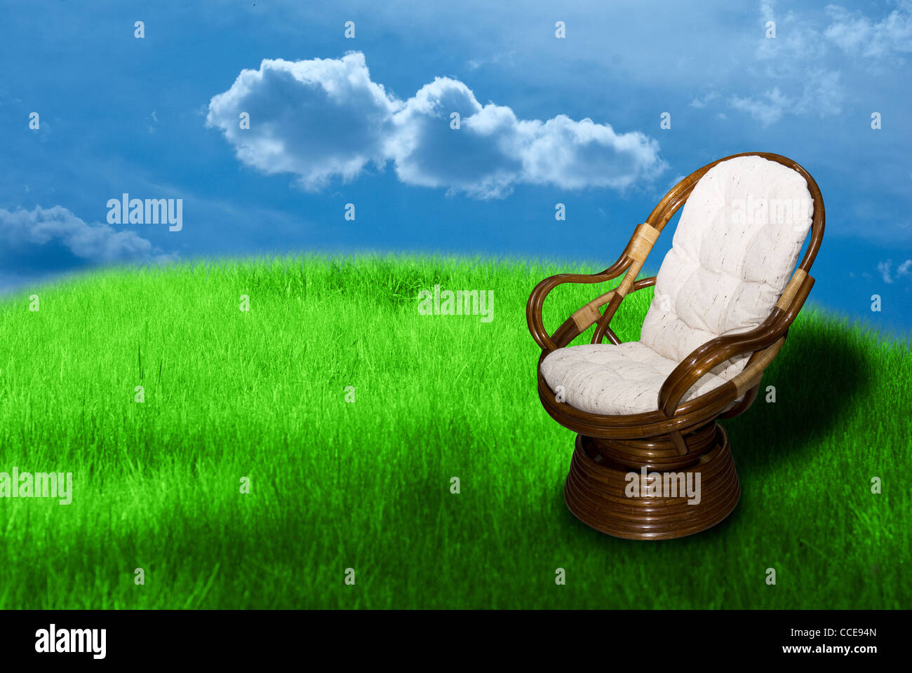 Rocking chair on green grass background Stock Photo - Alamy