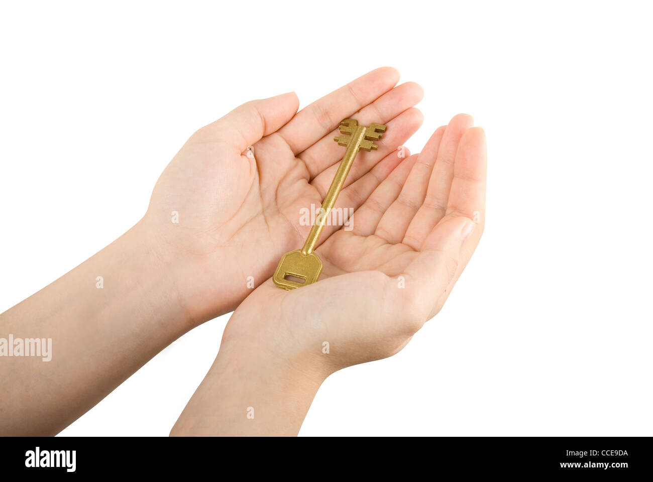 Fingers holding Golden key isolated on white background Stock Photo - Alamy