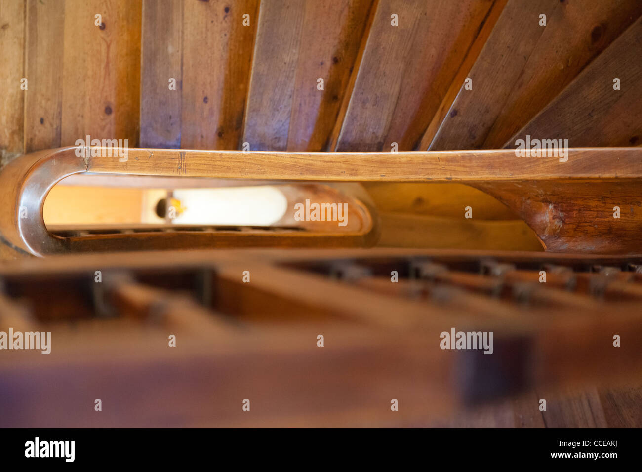 Looking down through the gap in wooden stairs Stock Photo - Alamy