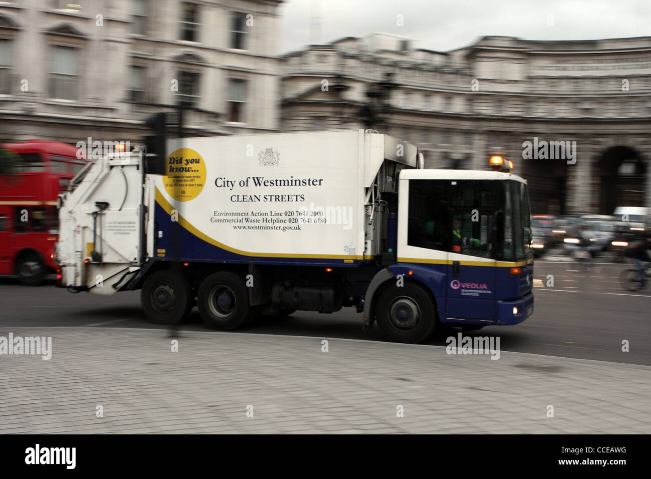 a refuse collection vehicle traveling in London Stock Photo - Alamy