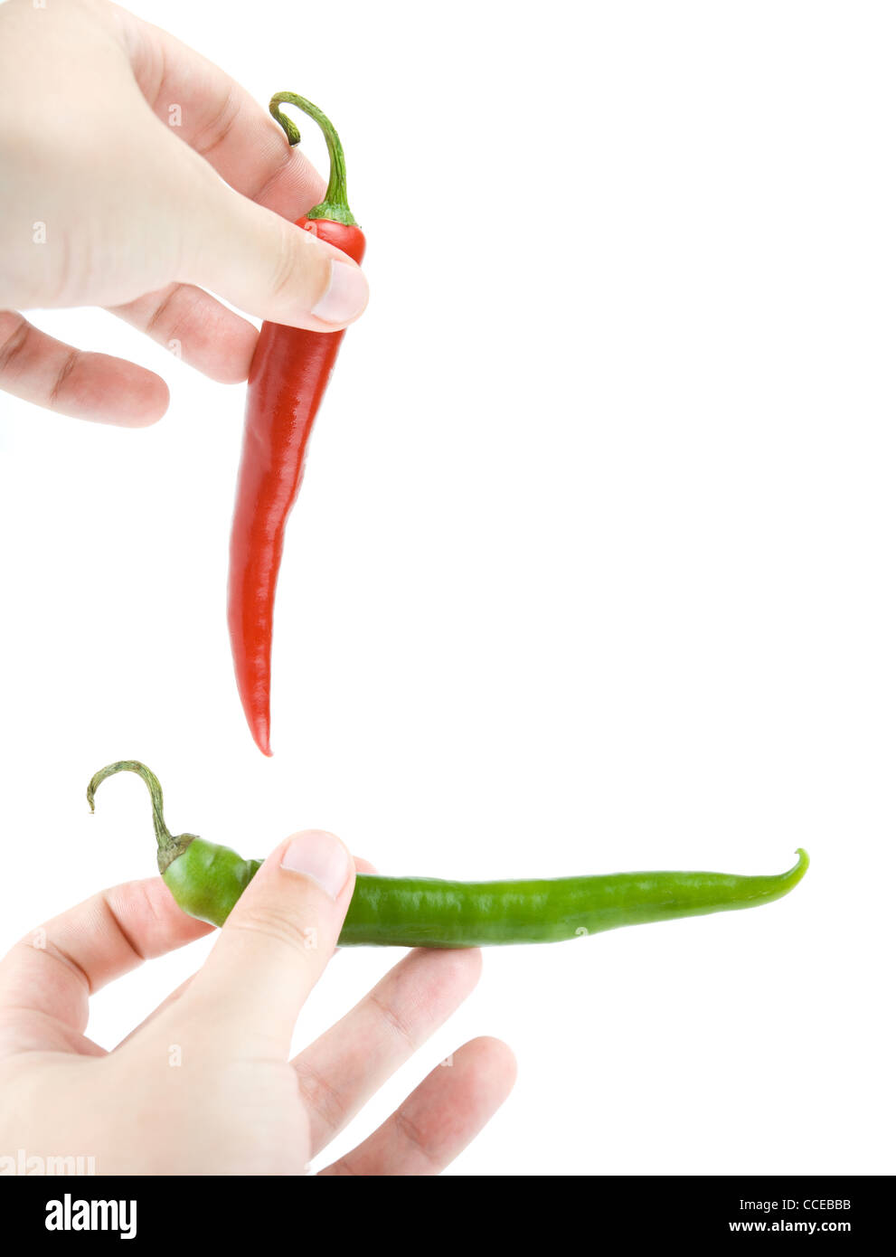 Hot peppers in hand isolated on a white Stock Photo - Alamy