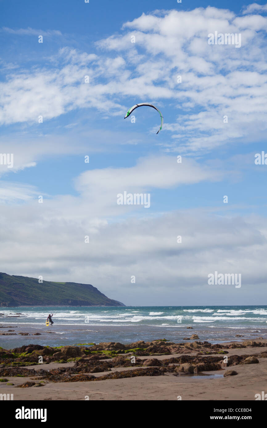 A male kite surfer controlling his kite before entering the water Stock ...