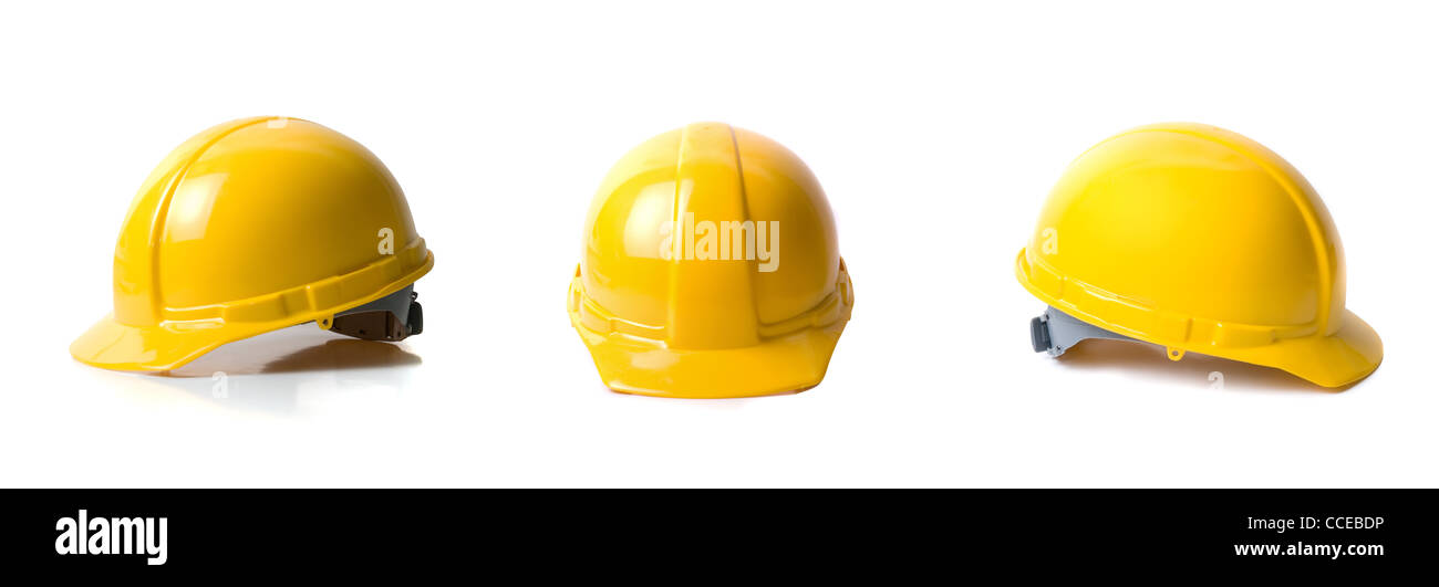 Yellow helmets set isolated on white background Stock Photo - Alamy