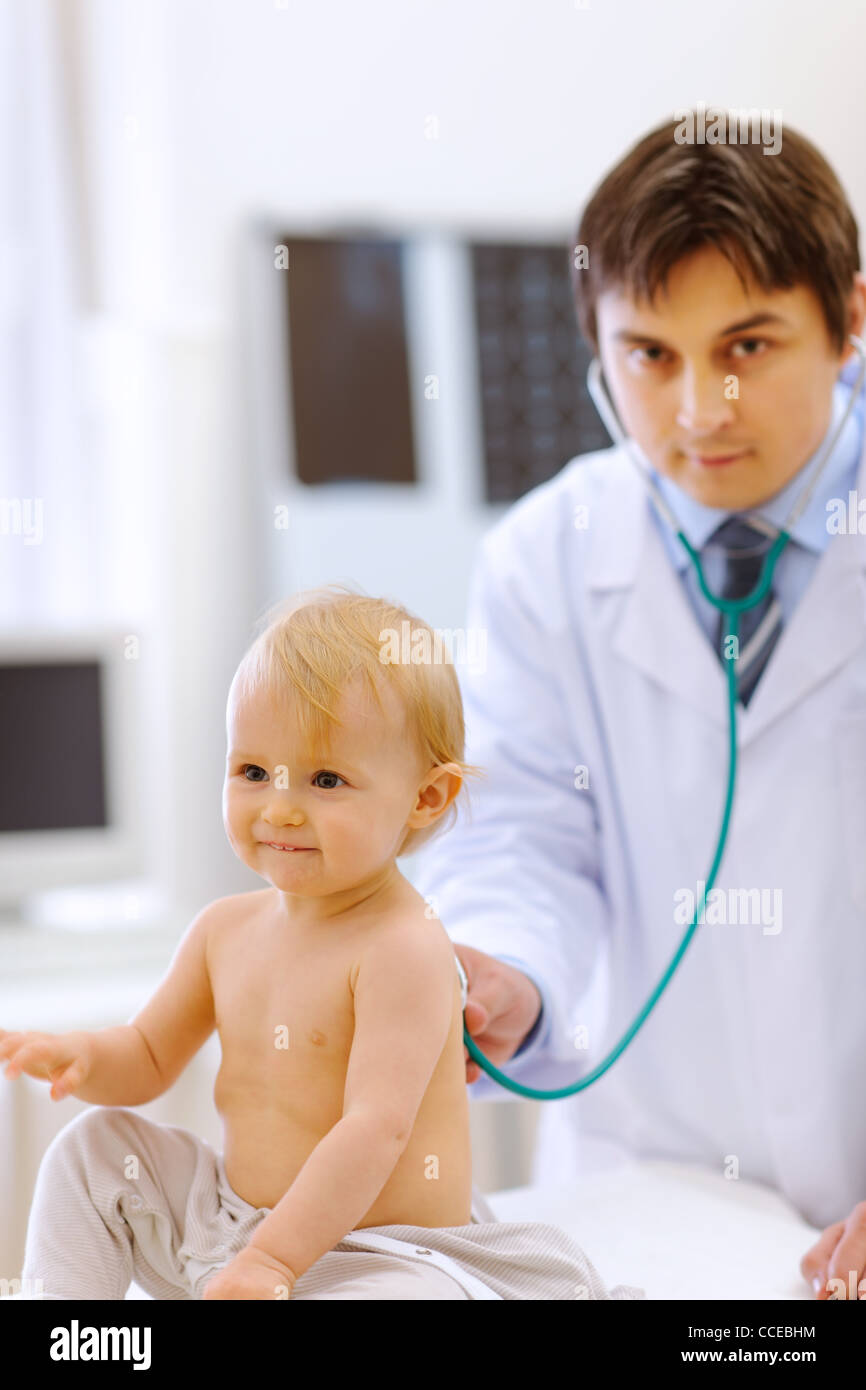 Cute baby being checked by a doctor using a stethoscope Stock Photo - Alamy