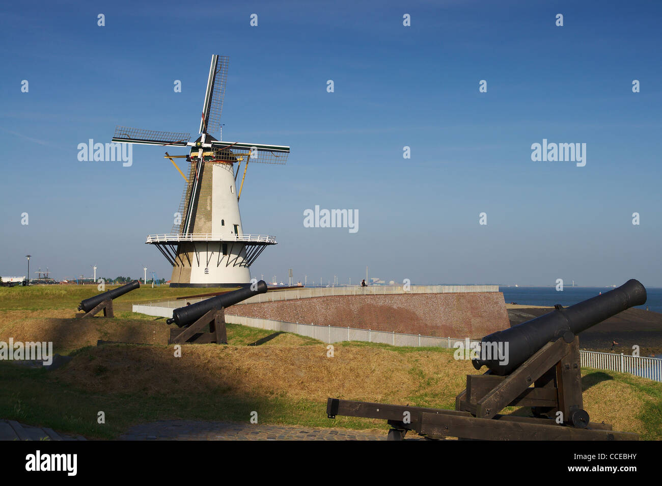 Old windmill with antique guns in Vlissingen at the Scheldt estuary ...