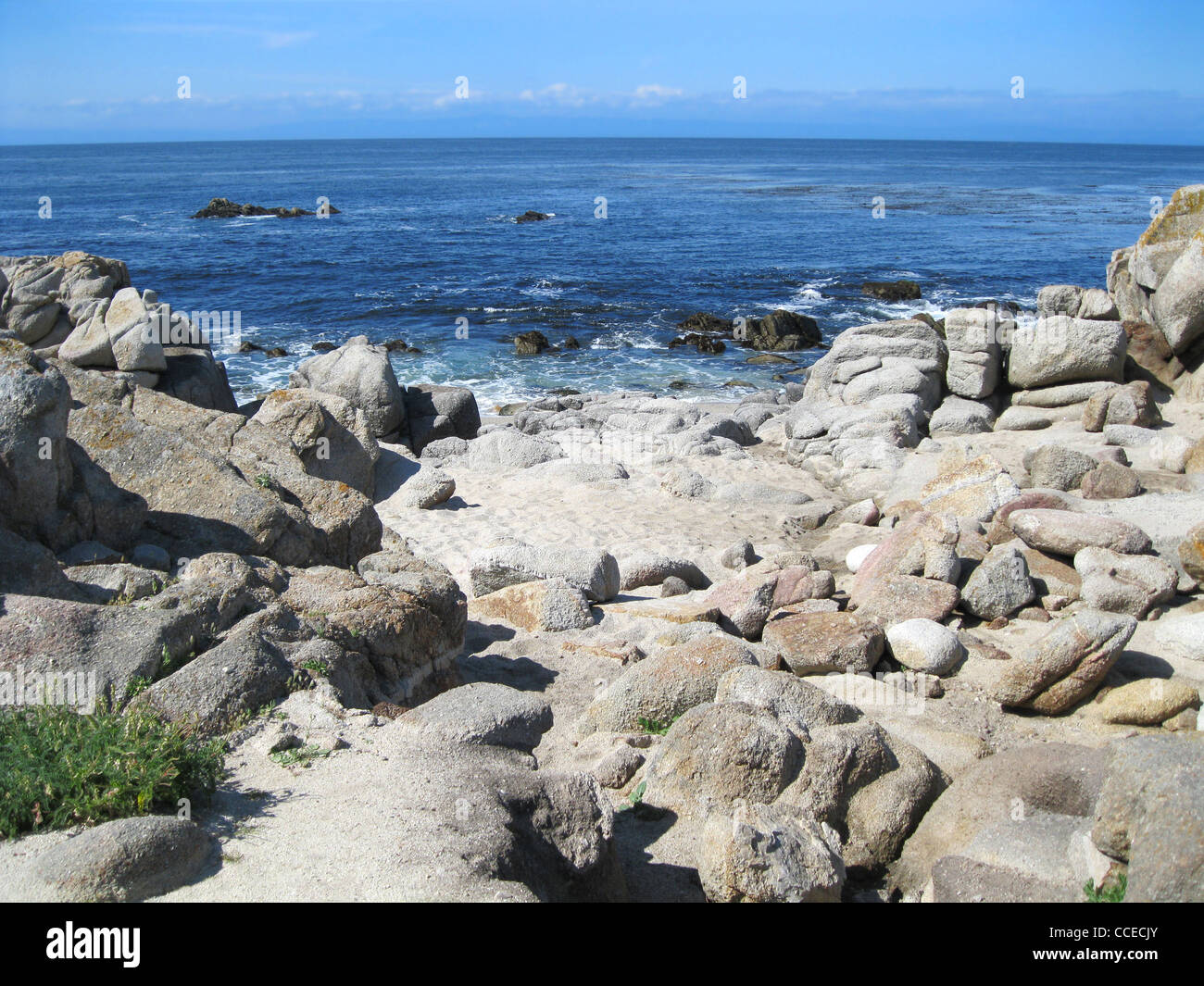 Seashore with pebbles and sand at the beach Stock Photo - Alamy