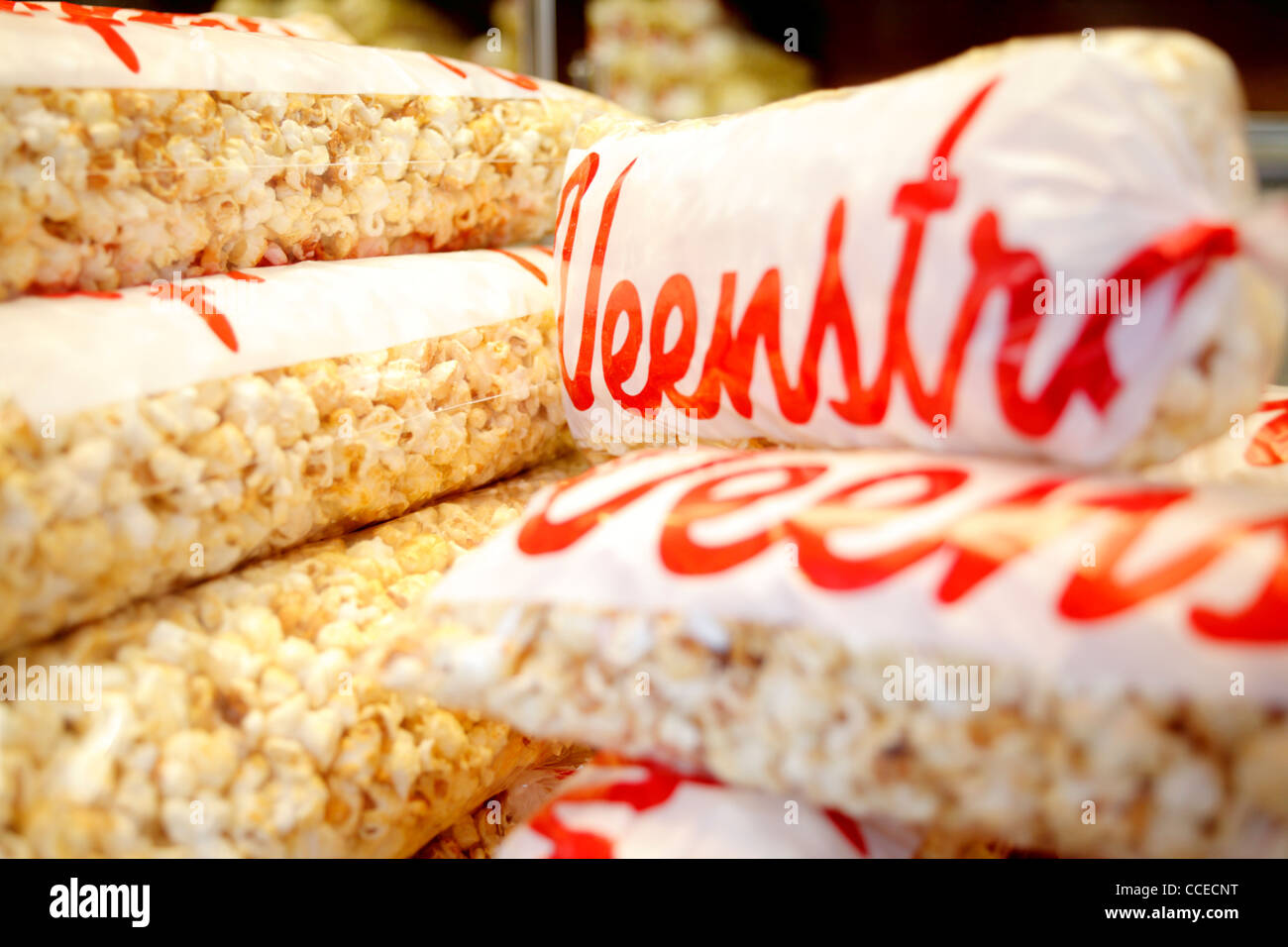 close up of window display with sweet popcorn packages at german mobile ...
