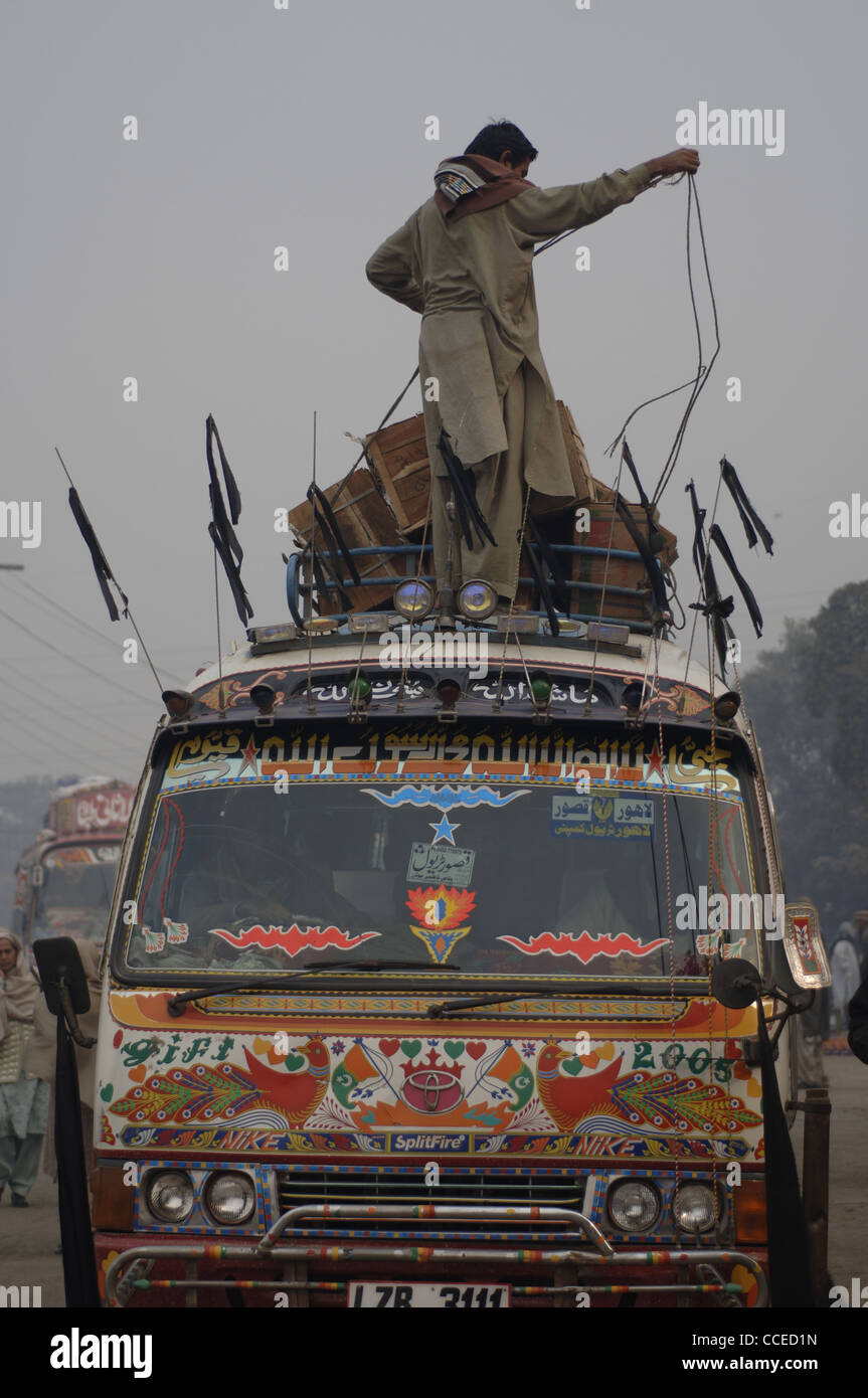 The driver of a colorfully decorated minibus departing from near the ...