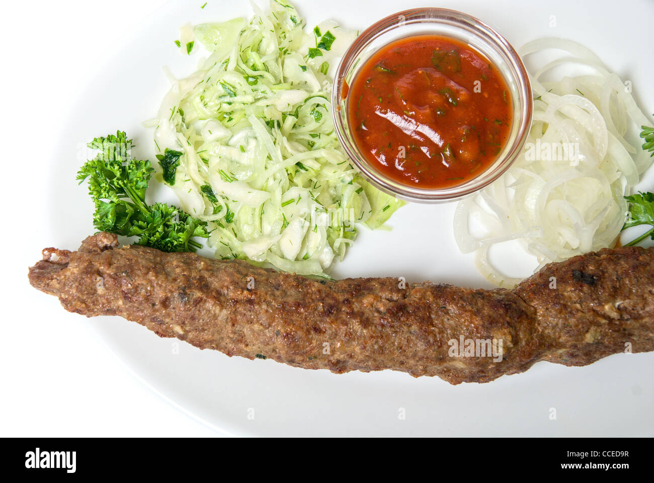 Close up minced mutton chop with sauce and vegetables Stock Photo - Alamy