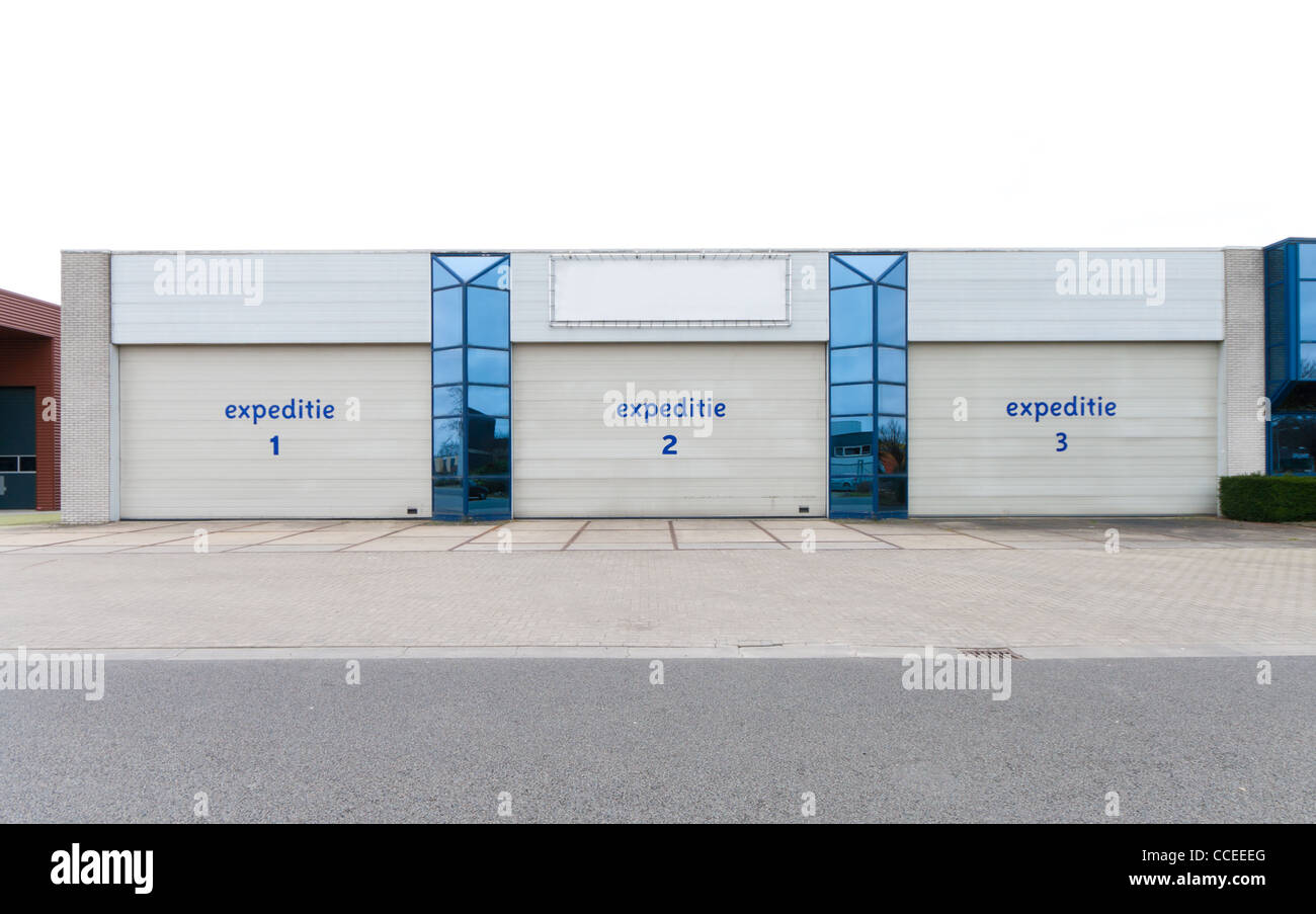 three loading docks at a small warehouse Stock Photo - Alamy