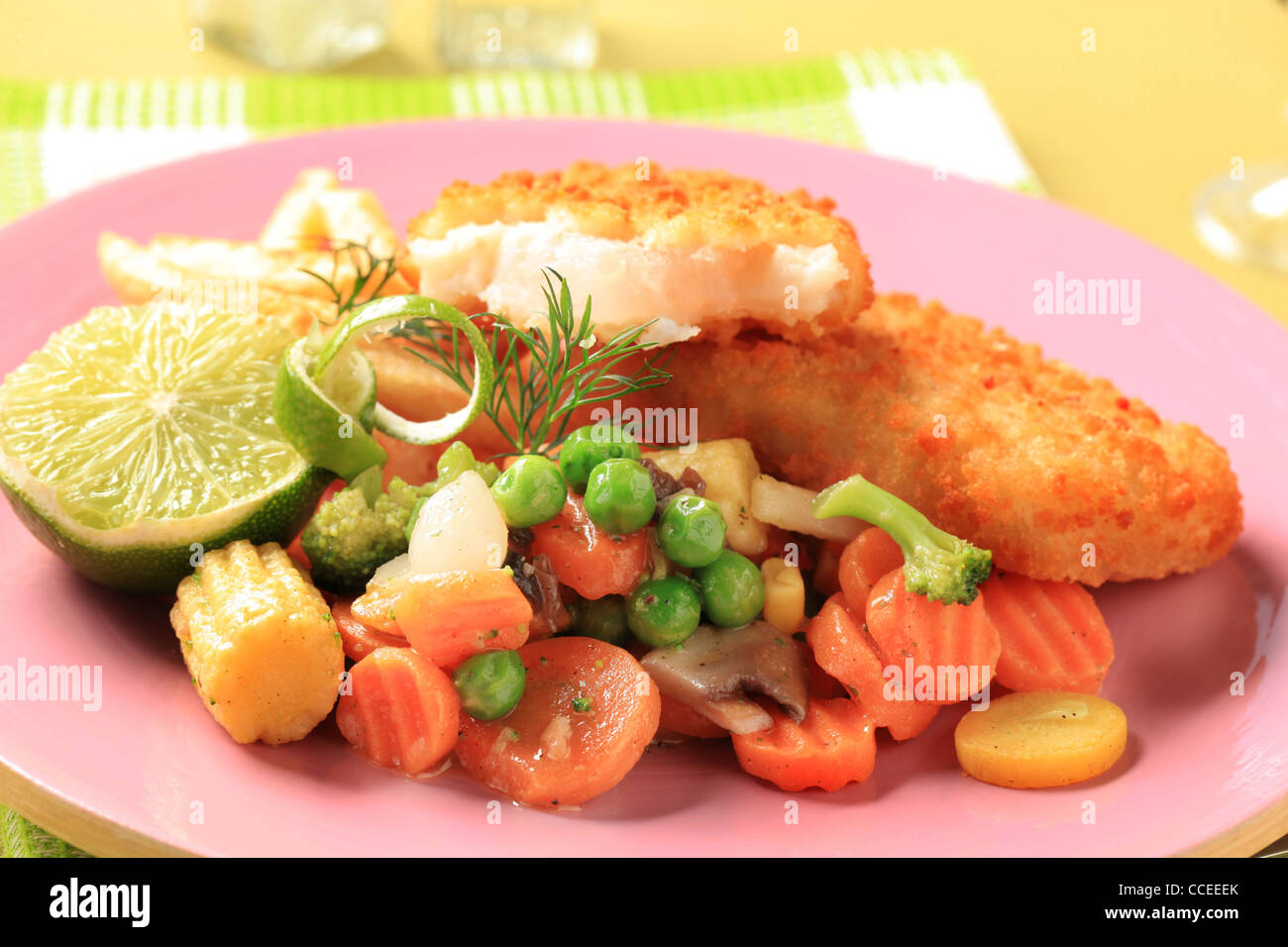 Fried fish served with French fries and mixed vegetables Stock Photo ...