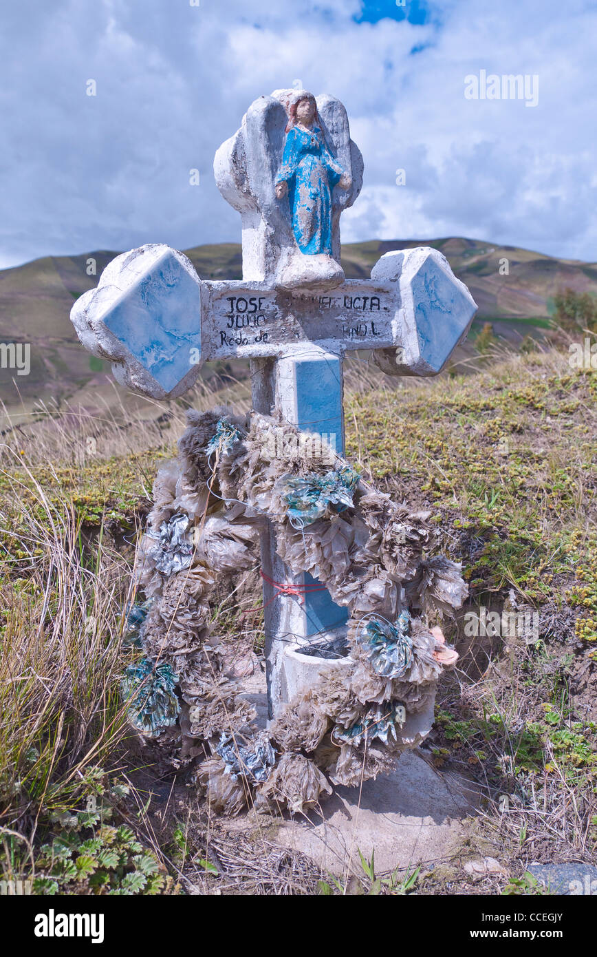 A roadside marker of a death from an automobile accident is a cross ...