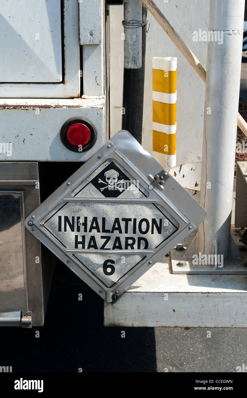 Hazard signs mounted on a fumigation truck Stock Photo - Alamy