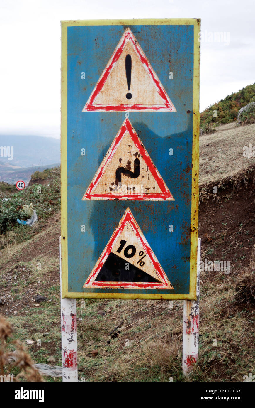 Rusty road sign in Albania Stock Photo - Alamy