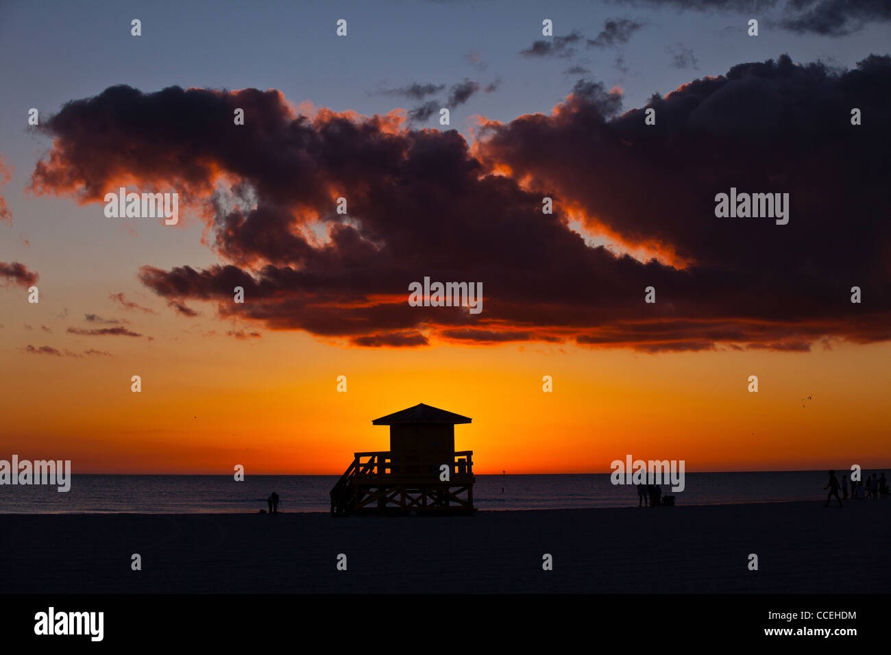 Sunset silhouettes lifeguard station on famed white powder sand Siesta ...