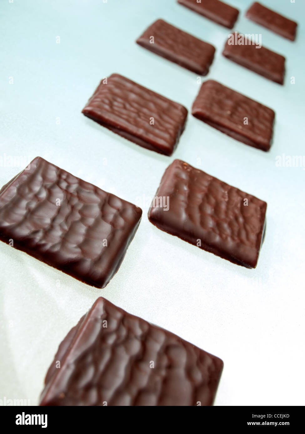 Chocolate blocks on a glass or ice background Stock Photo - Alamy