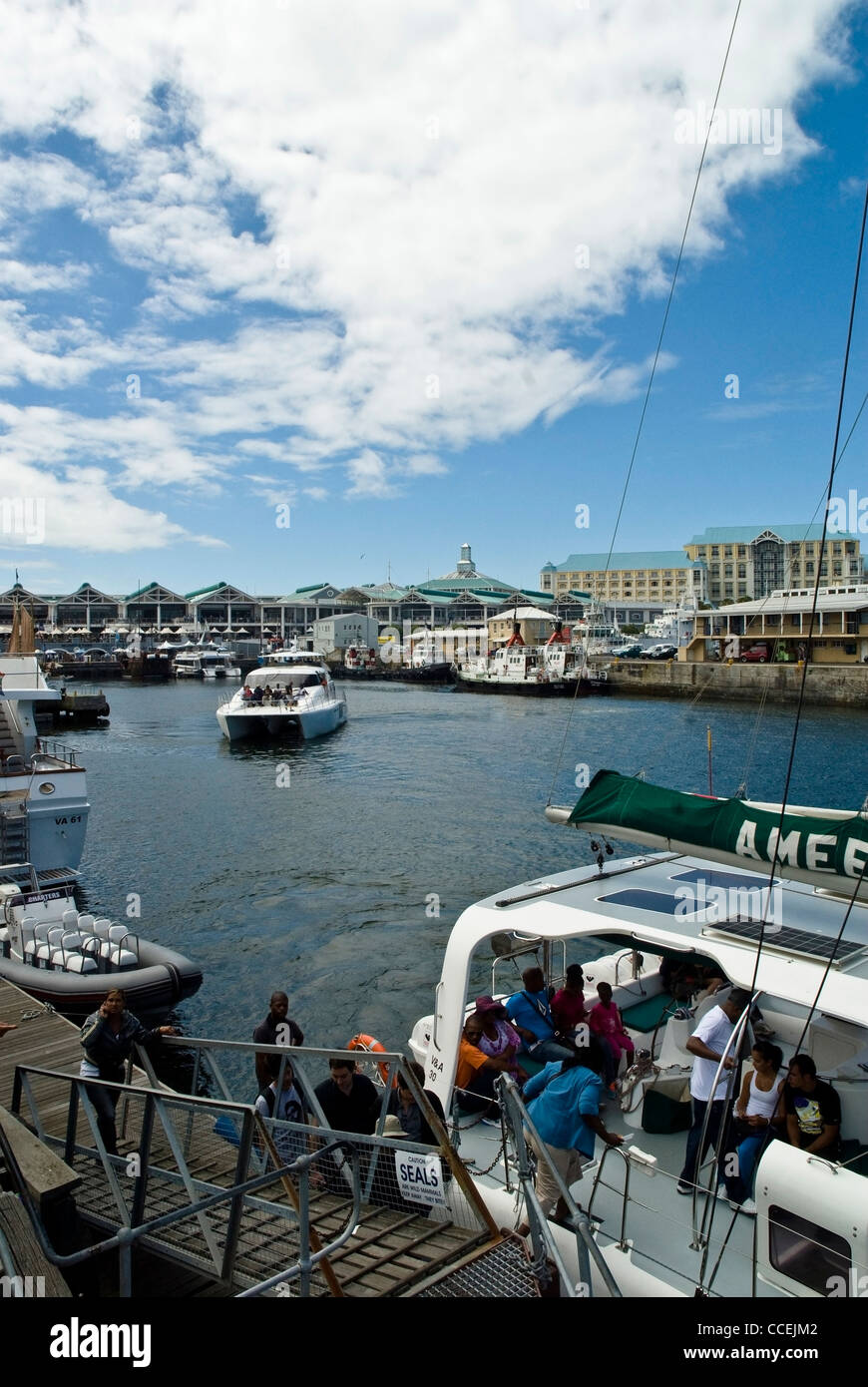 Tourists depart on a cruise from the V&A Water Front around Cape Bay in ...