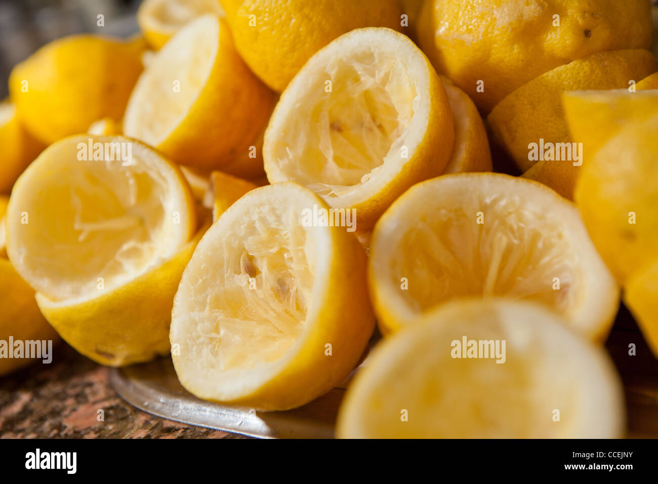 citrus fruit : Lots of squeezed lemons with whole lemon after squeezing ...