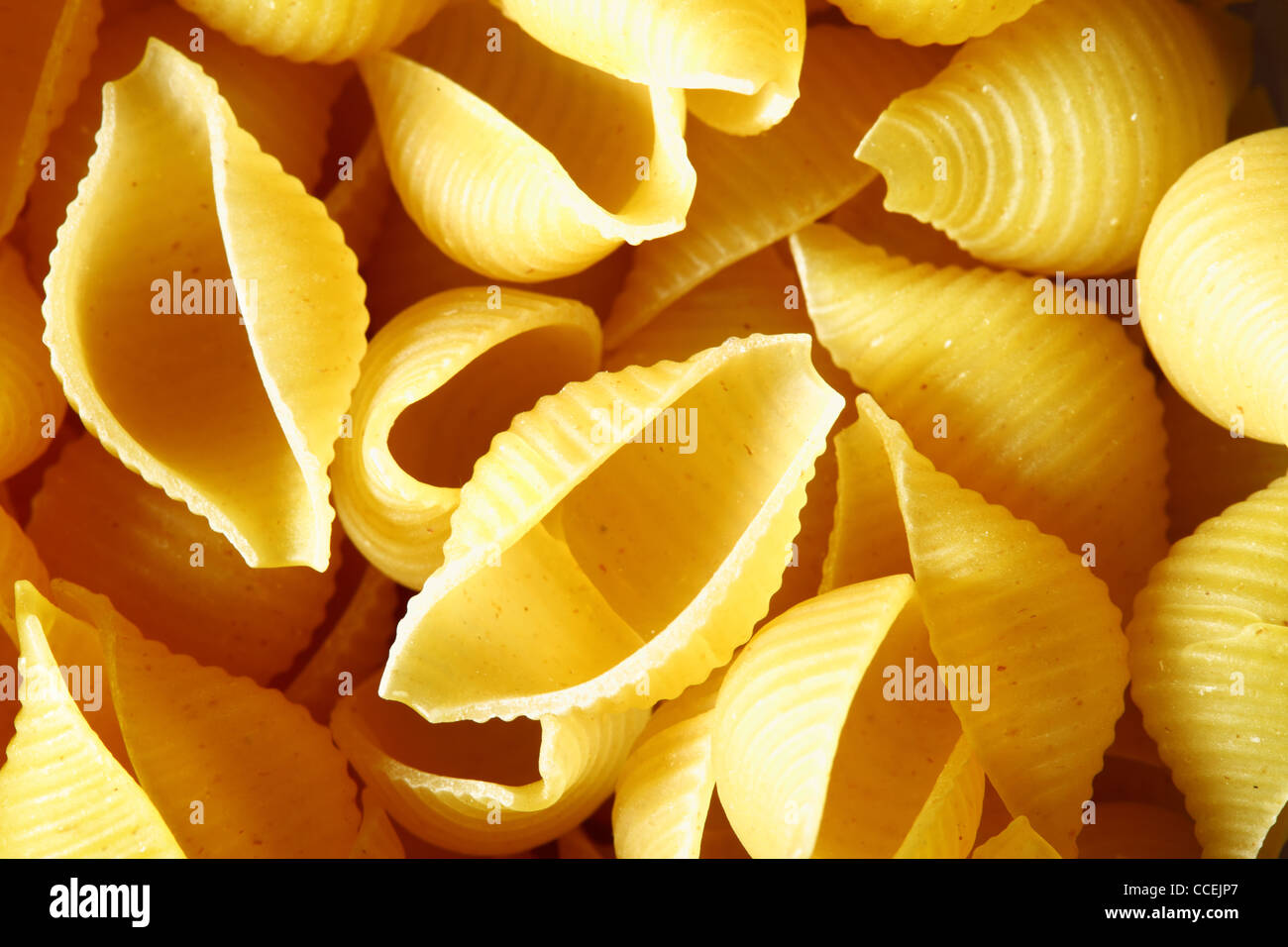 Uncooked italian pasta, may be used as background Stock Photo - Alamy