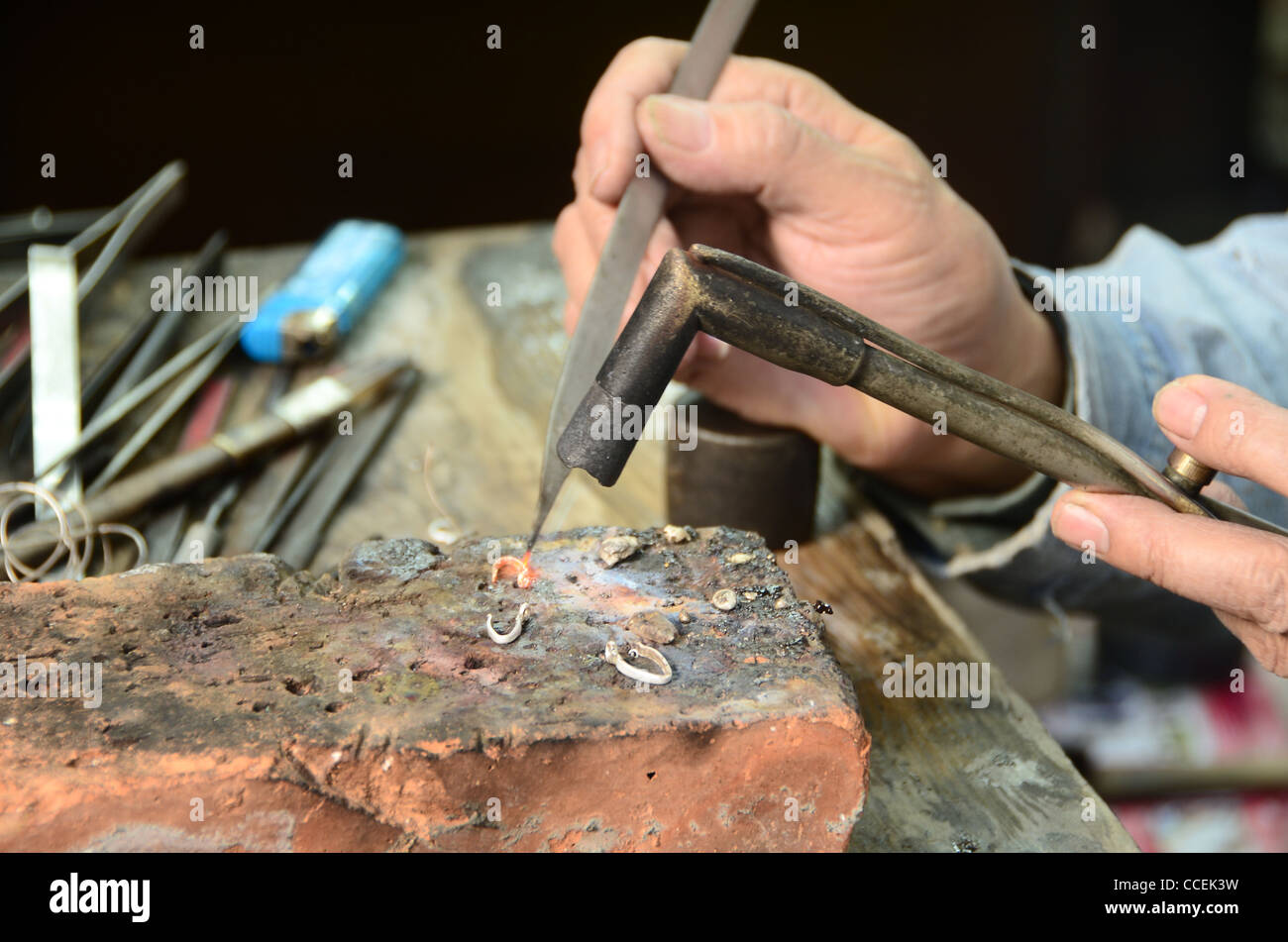 a Close up a a man working with metal Stock Photo - Alamy