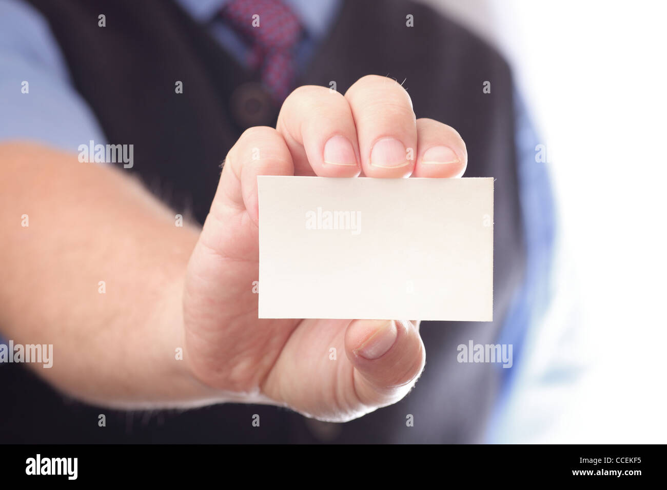 Businessman showing business card - focus on fingers and card. You can ...