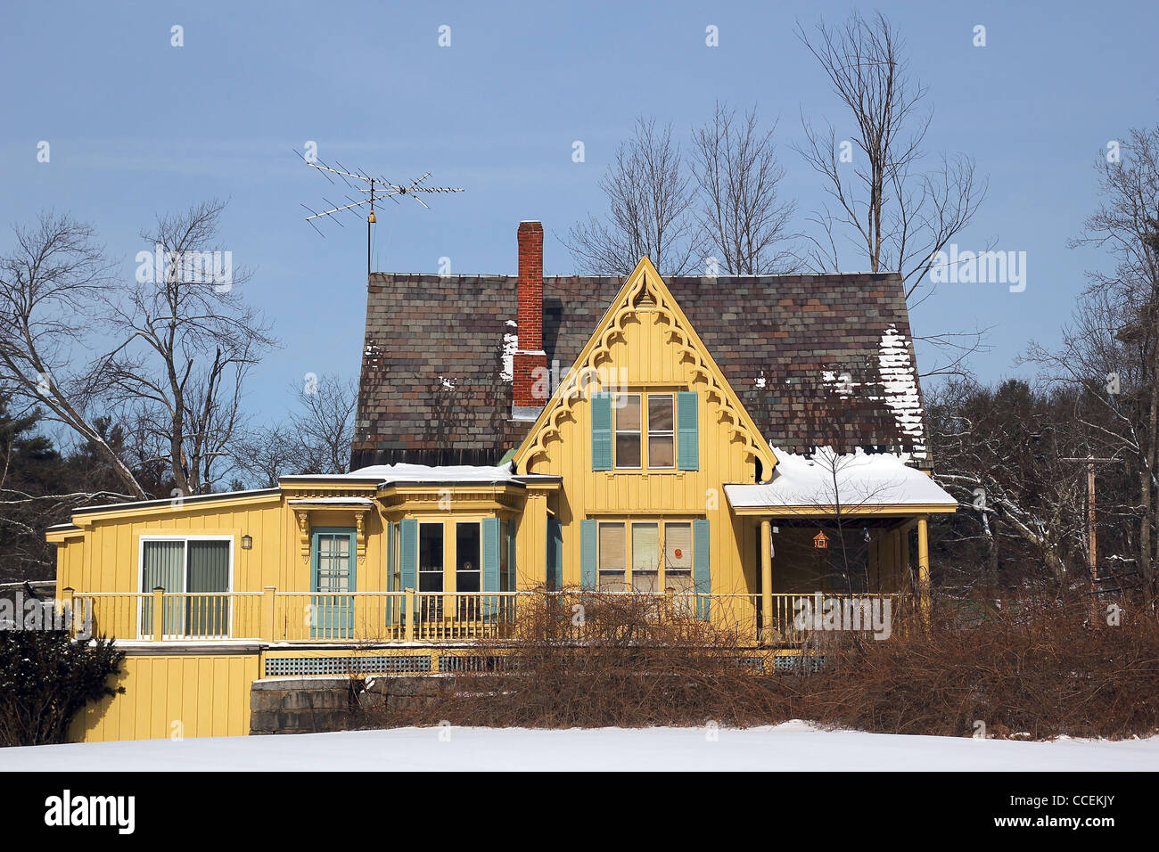 A yellow house in a small New England town in winter Stock Photo - Alamy