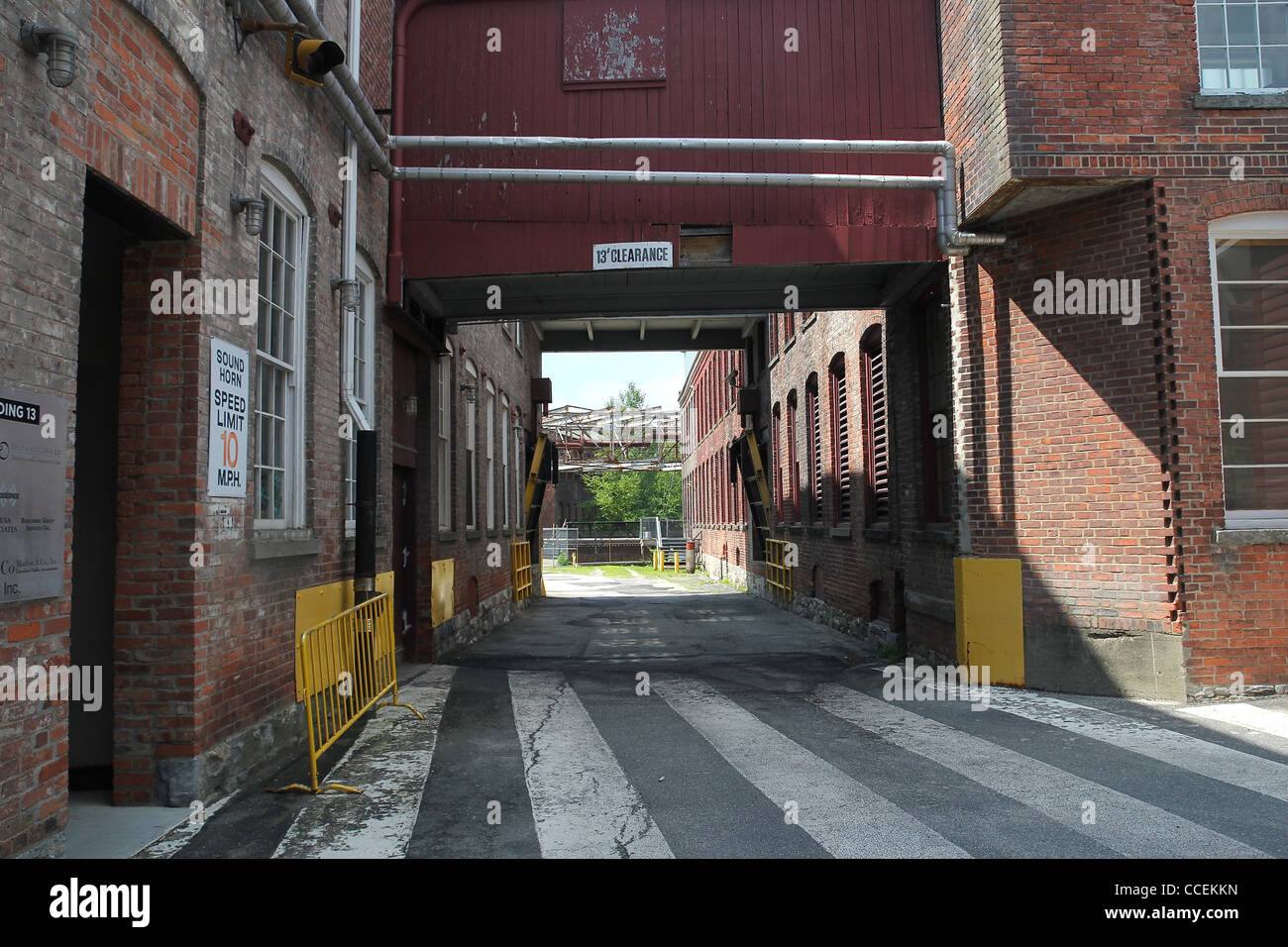 Passage between old factory buildings hi-res stock photography and ...