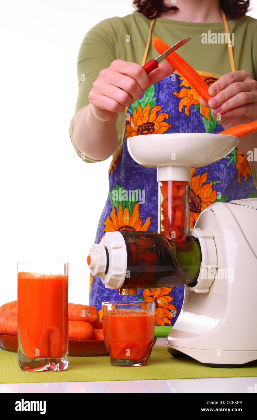 Woman Juice extractor and carrot isolated white kitchen prepare Stock ...
